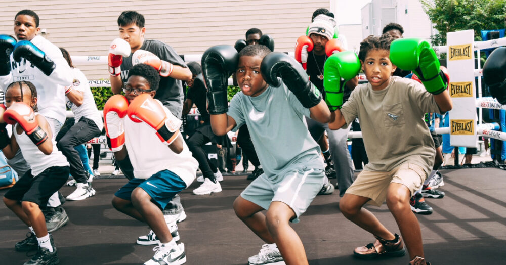Boots hits the block: Ennis leads hundreds at South Philly community ...